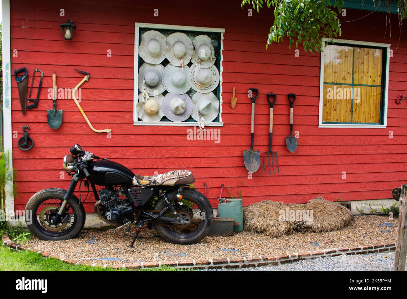 Tools and equipments farm gardening on red wooden wall of barn ...
