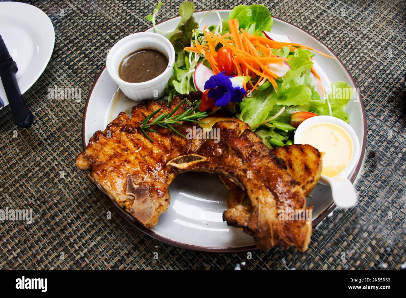 Thai chef cooking food fusion style cuisine roasted grilled fried Pork ...