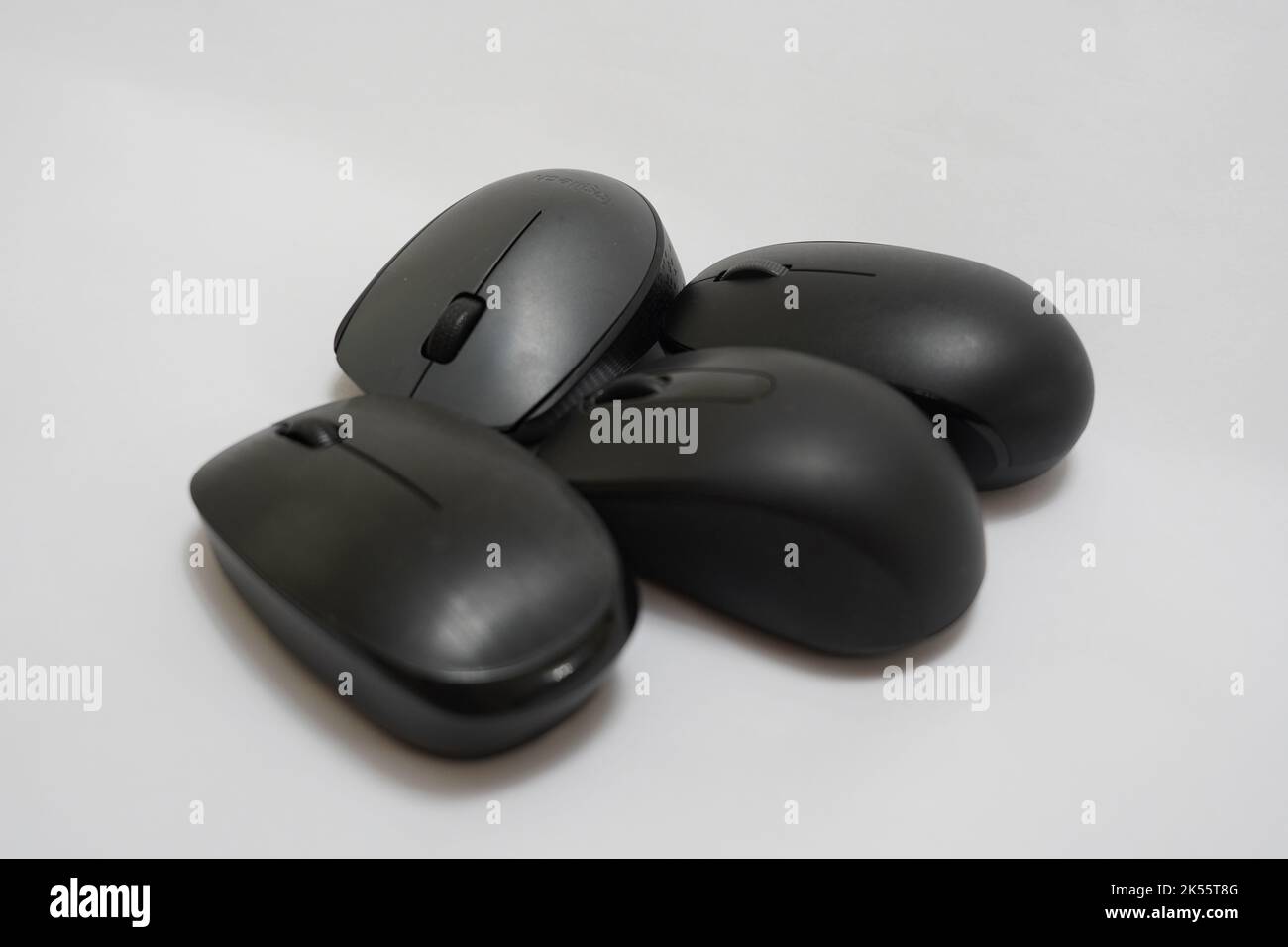 four different wireless mice on a white background Stock Photo - Alamy