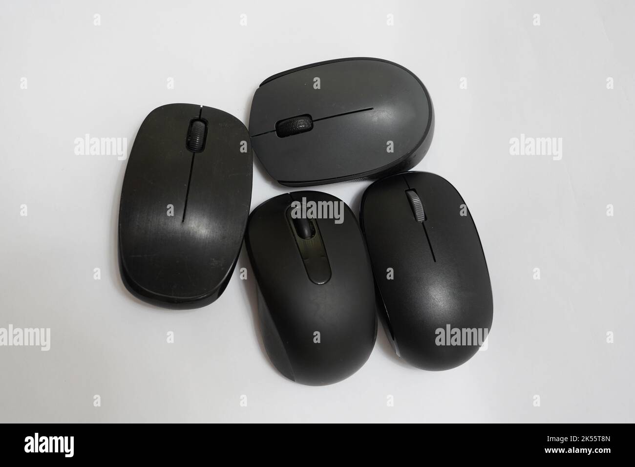 four different wireless mice on a white background Stock Photo - Alamy