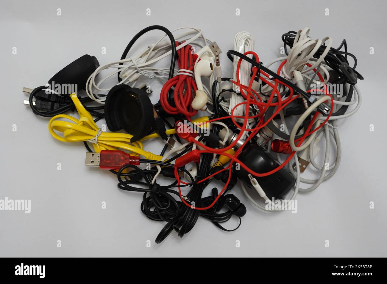 tangled cables of different types on a black background Stock Photo - Alamy