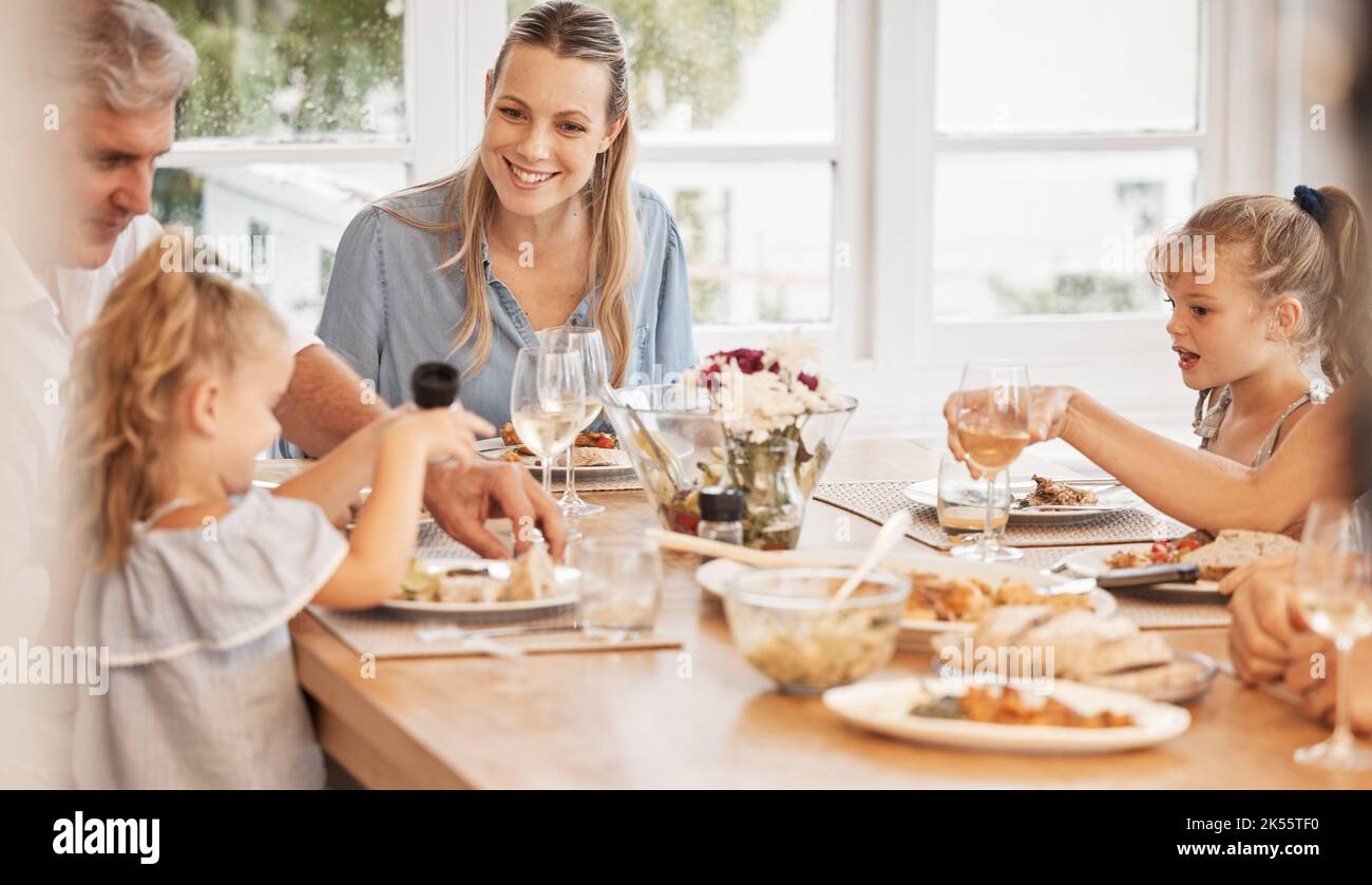 Love, food and family eating at table, relaxing and sharing a meal in ...