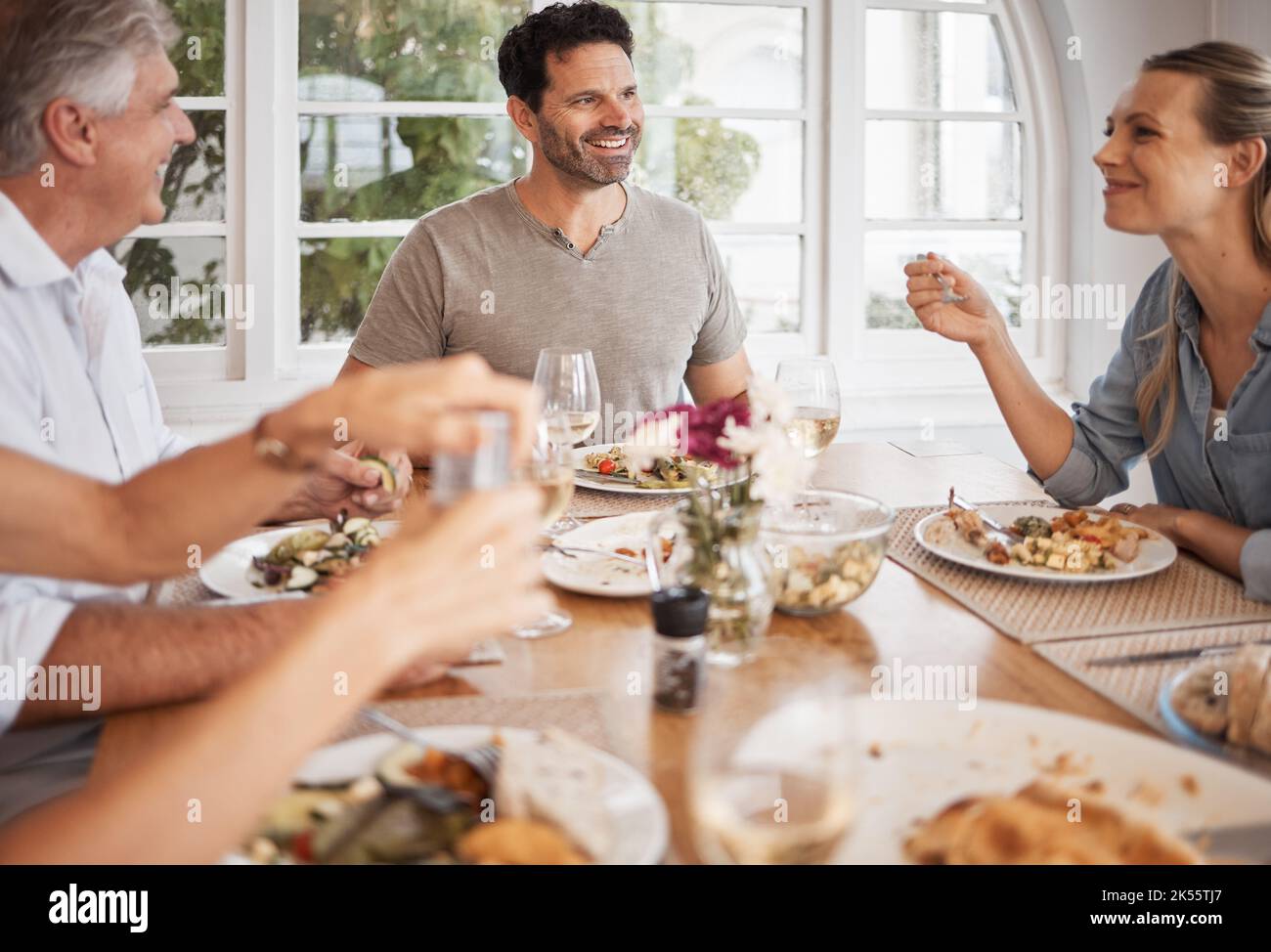 Family, bonding or thanksgiving food on table in house, home or ...