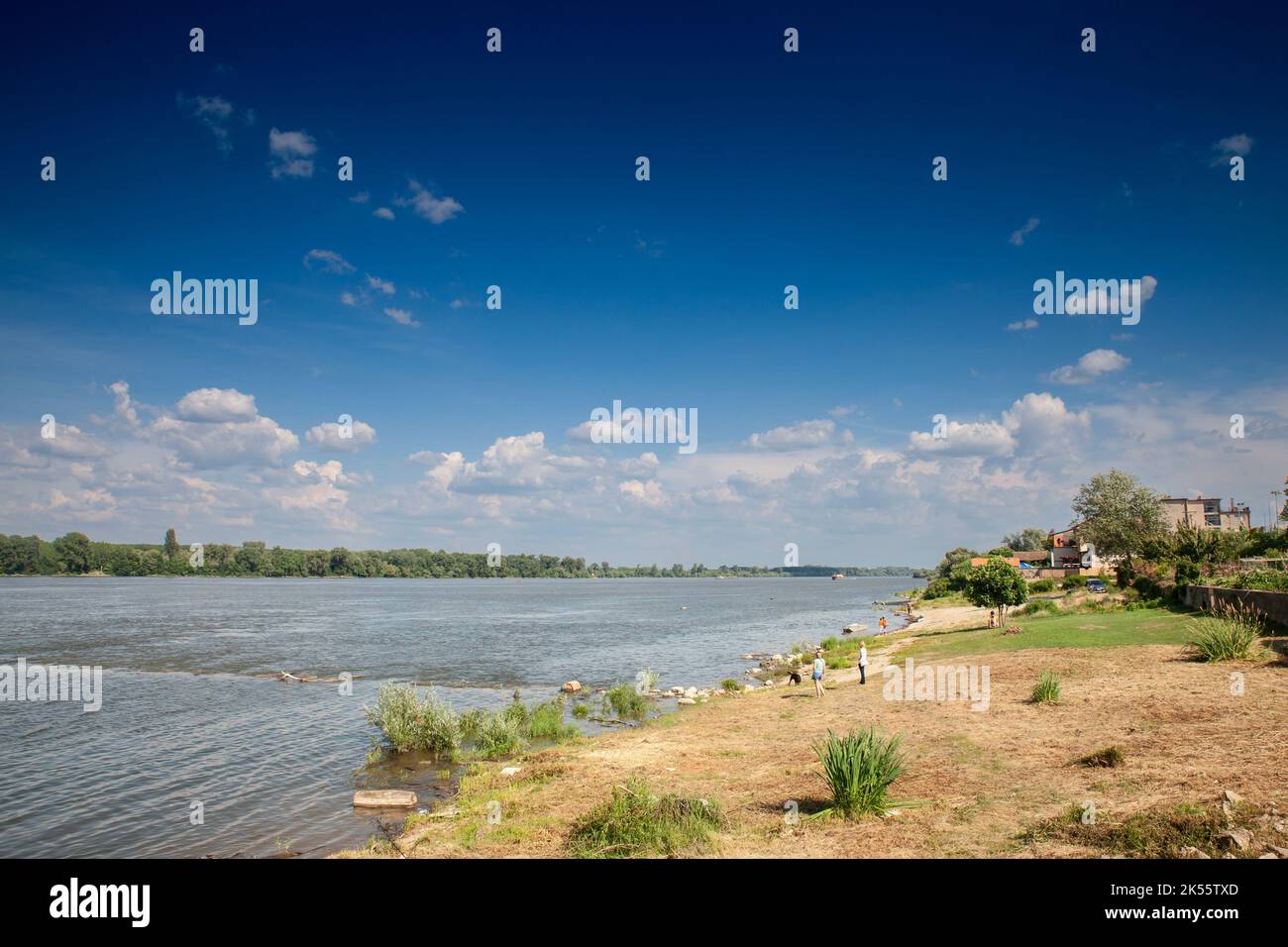 Panorama of the Danube river in Serbia with people on a beach during a ...