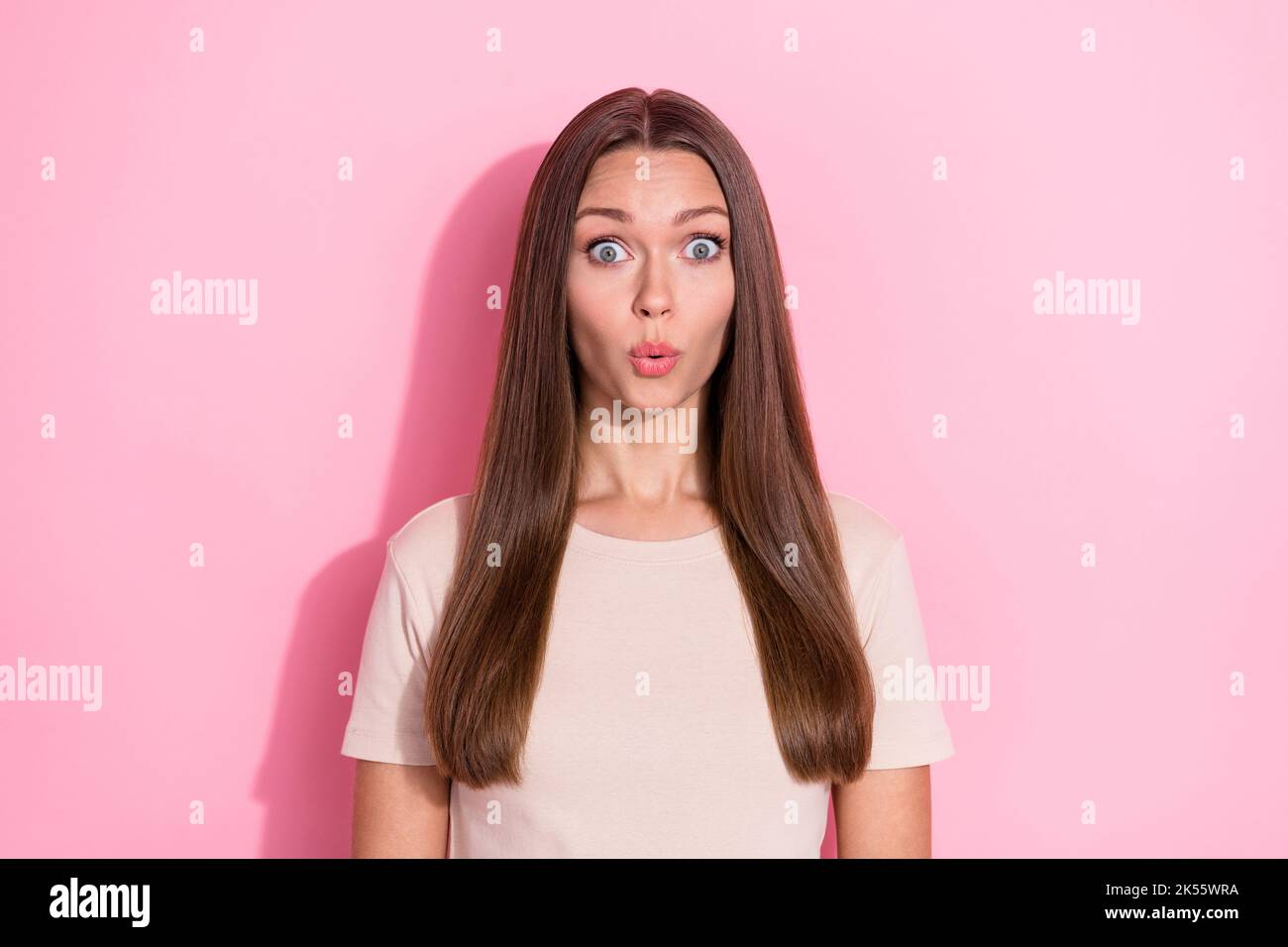 Portrait of shocked young lady pouted lips staring cant believe ...