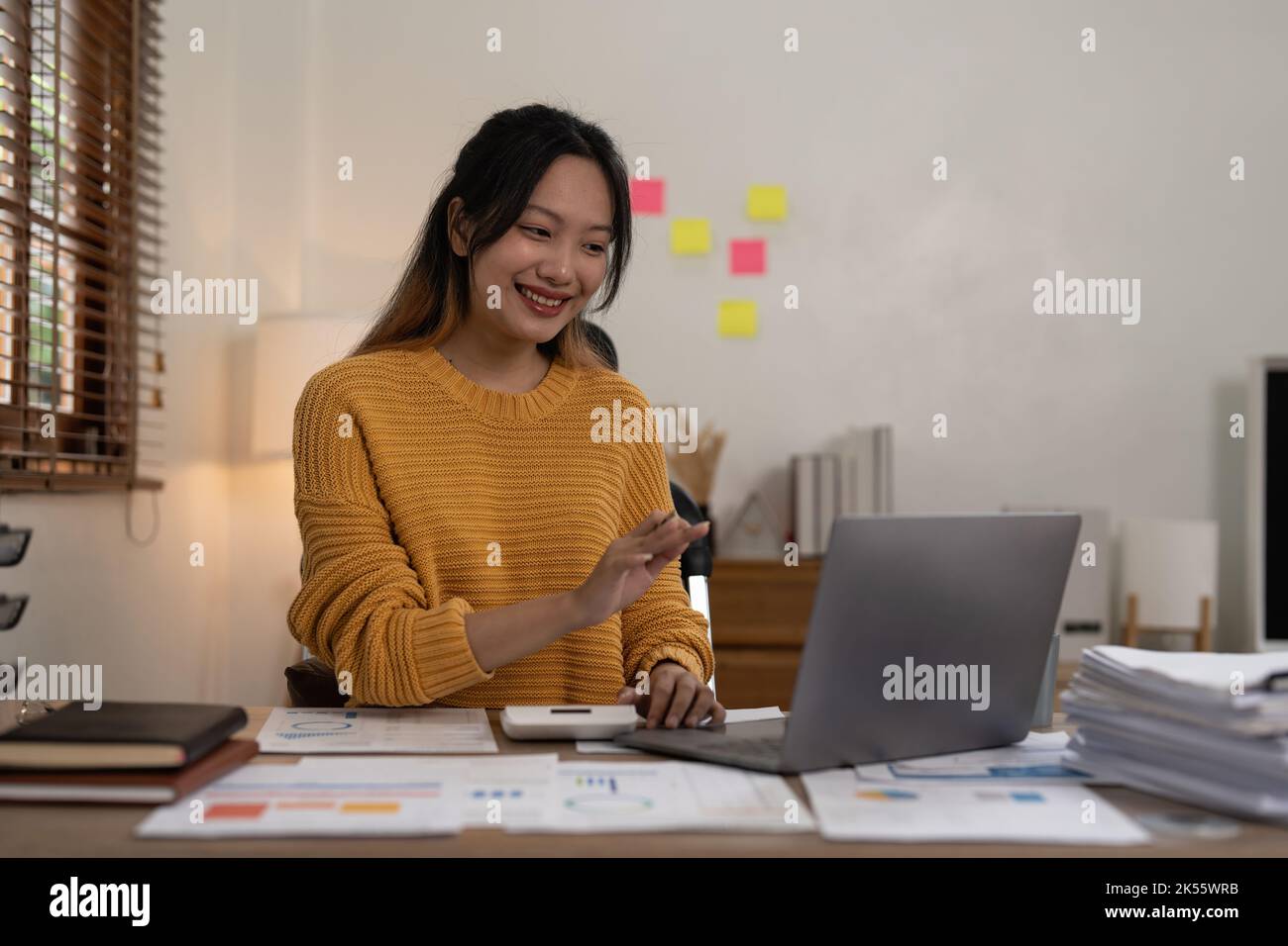 Asian Accountant video call with client by laptop. work from home ...
