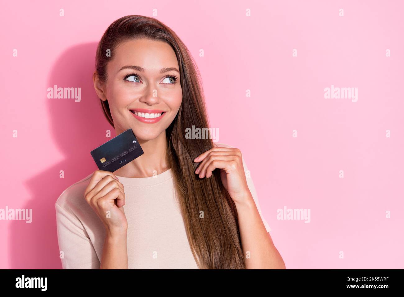 Portrait photo of young toothy beaming smile lady look dreamy hold bank ...