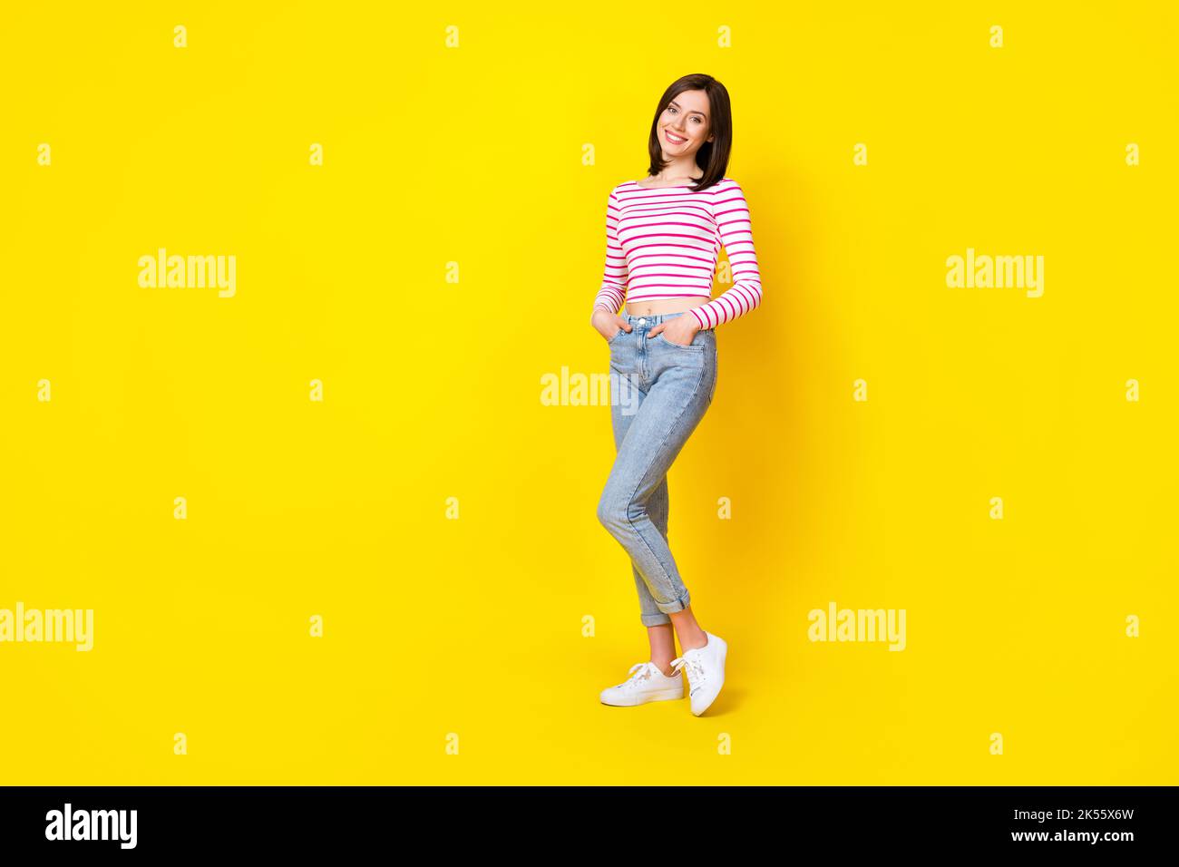 Full length photo of lovely young woman shopping try on new jeans ...