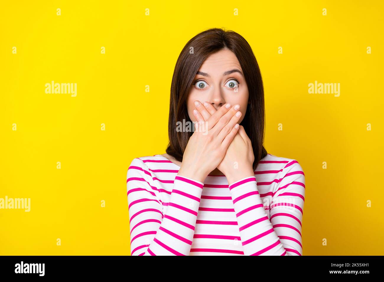 Photo portrait of pretty young lady hands cover mouth scared staring ...