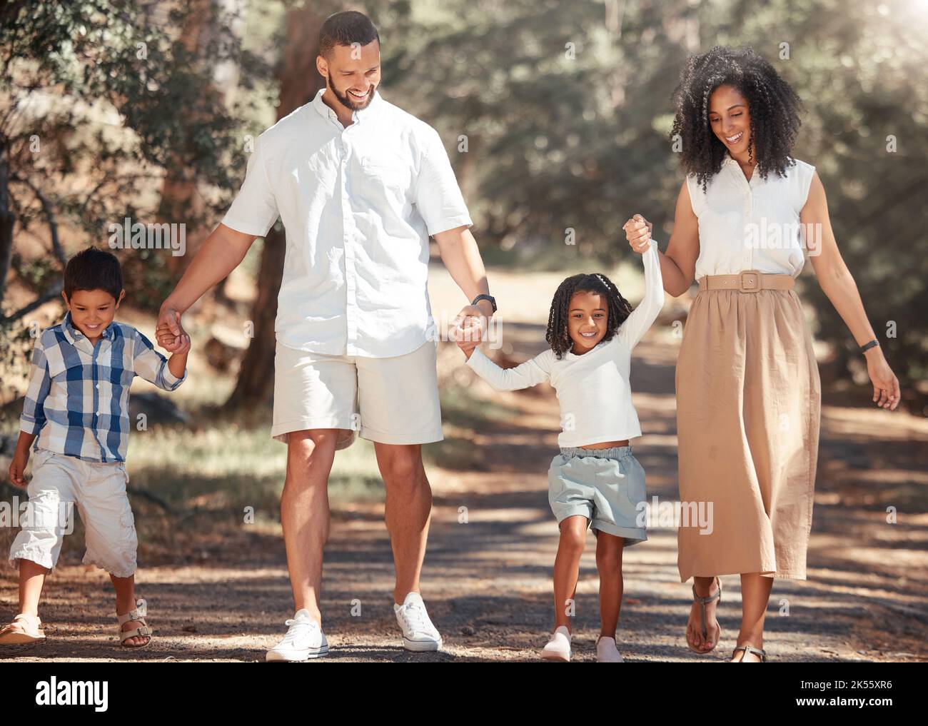 Family, love and kids walking with parents in park, happy and relax in ...