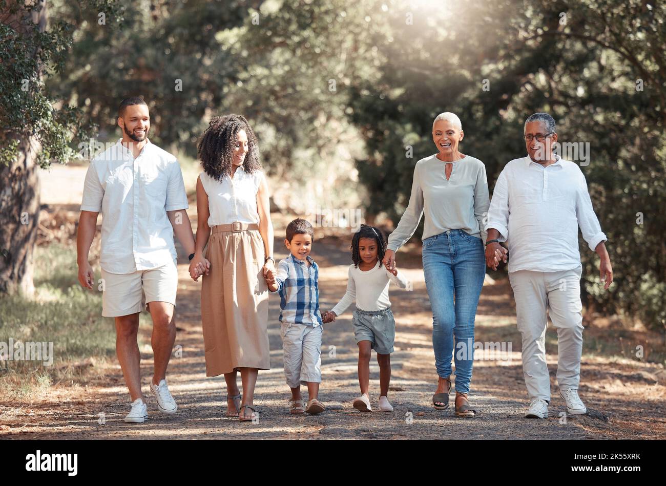 Summer, happy and black family walk in a park, bonding and having fun ...