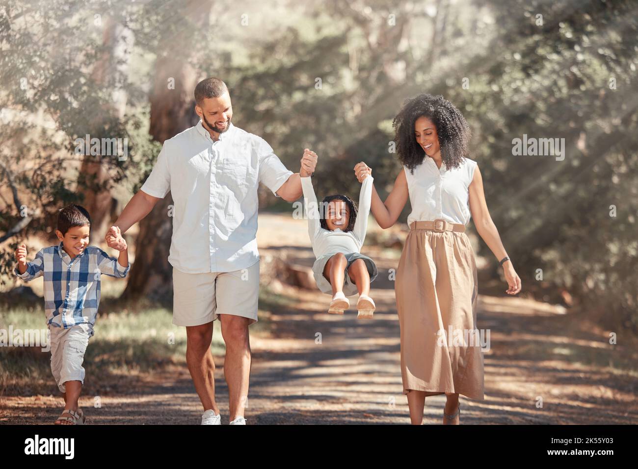 Family, happy and park summer fun of a father, mother and children ...