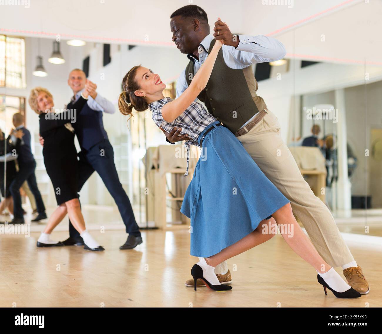 Woman and man dancing waltz in studio Stock Photo - Alamy