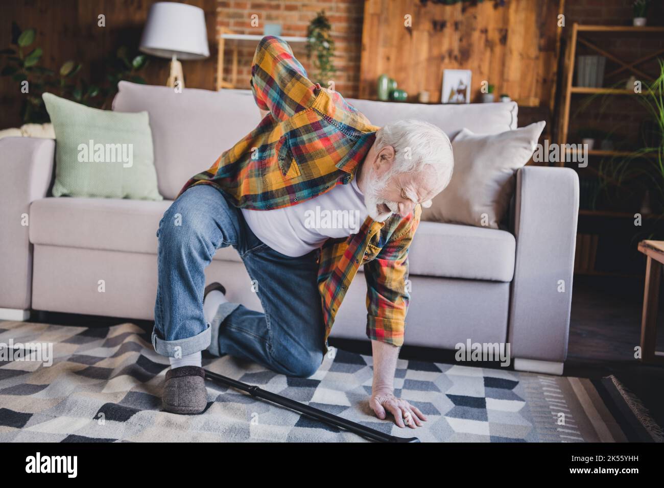 Photo of stressed unhappy retired man dressed plaid shirt falling floor ...