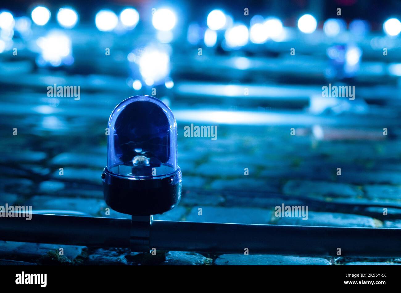 A closeup of a blue flashing siren on the street at night Stock Photo ...