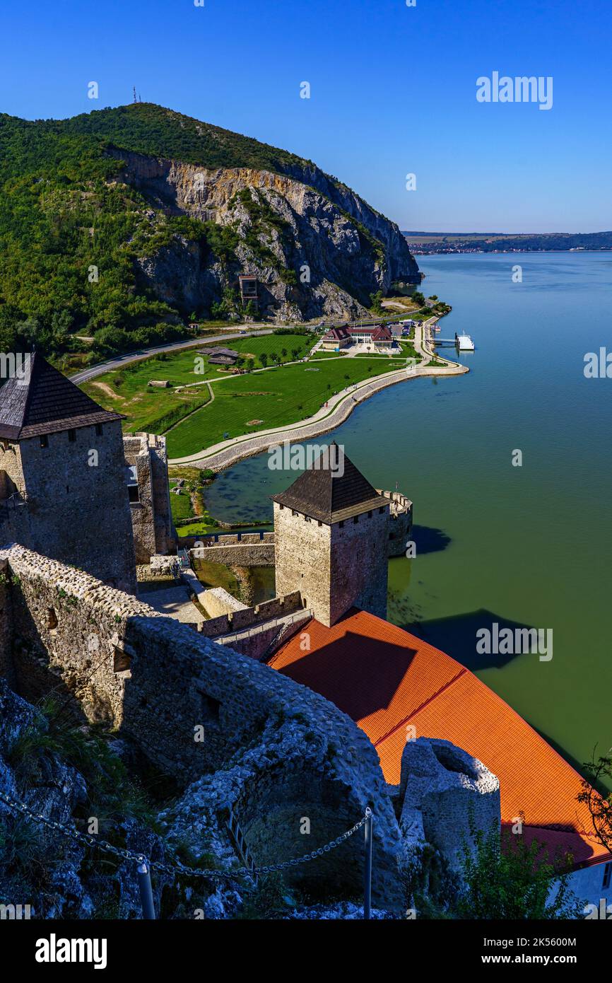 An aerial view of Golubac Fortress by Danube river and lush green ...