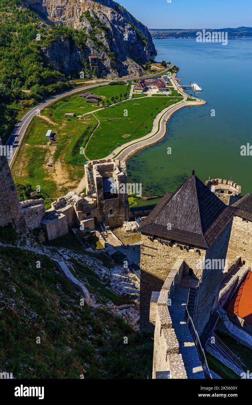 An aerial view of Golubac Fortress by Danube river and lush green ...