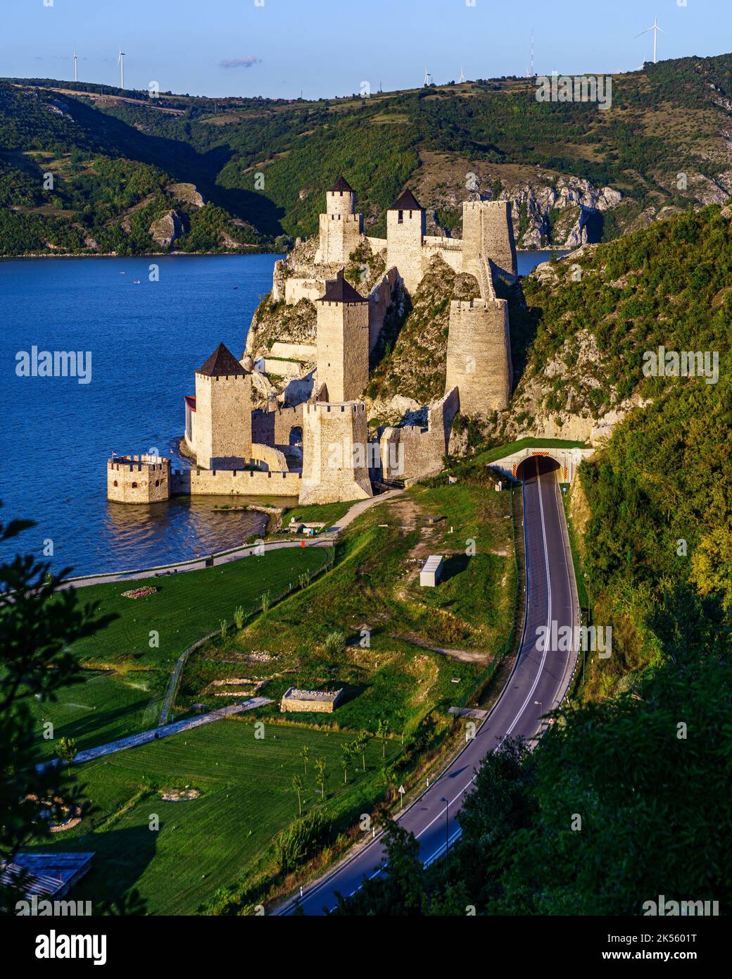 An aerial view of Golubac Fortress by Danube river and lush green ...