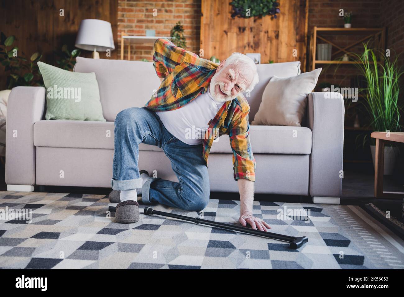 Photo of sad stressed retired man dressed plaid shirt falling floor ...