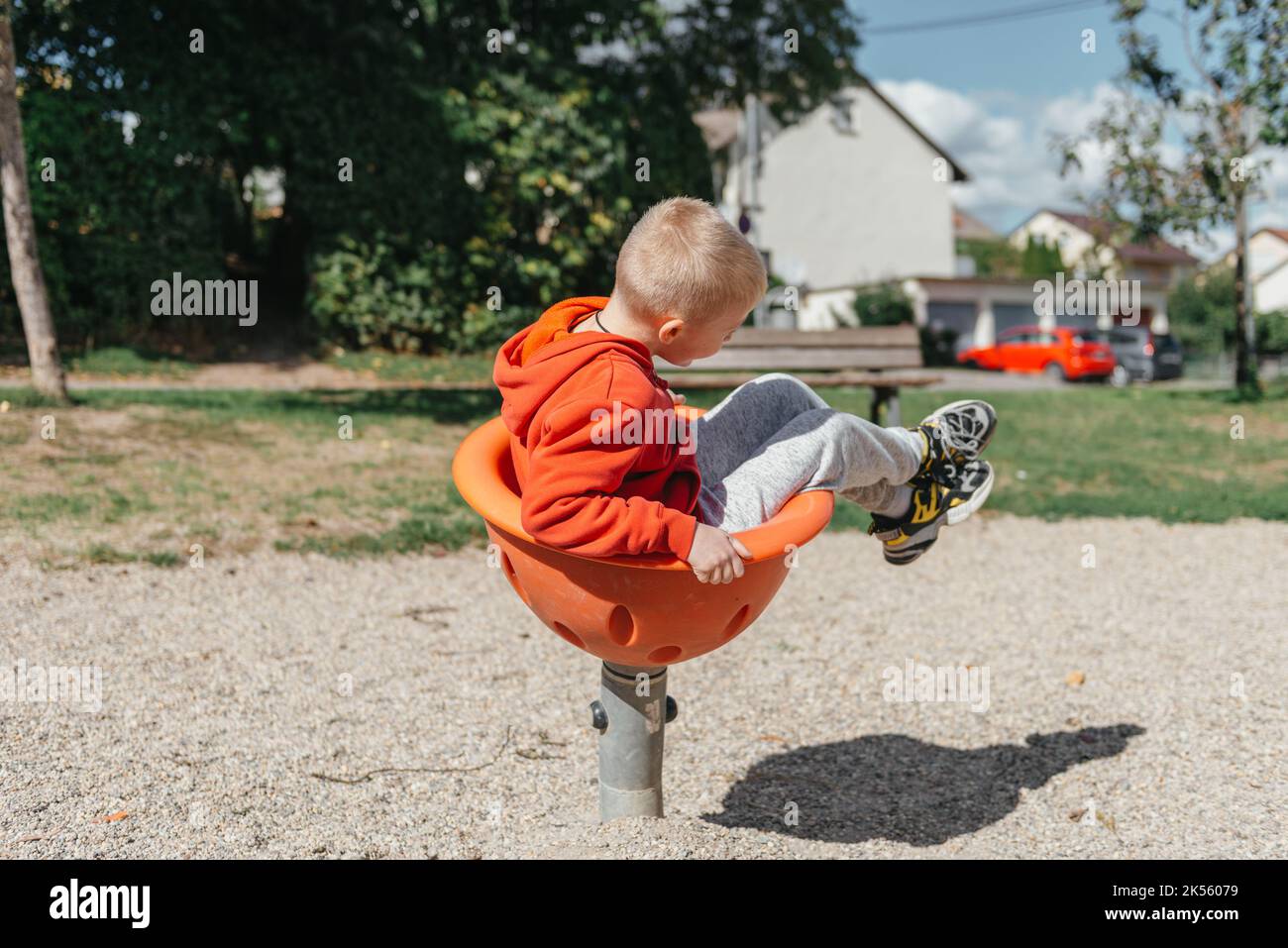 Funny cute happy baby playing on the playground. The emotion of ...