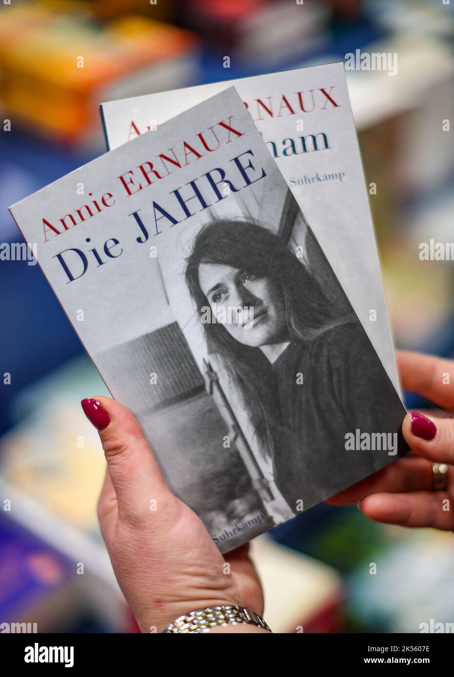 Leipzig, Germany. 06th Oct, 2022. A woman holds two books, "The Shame ...