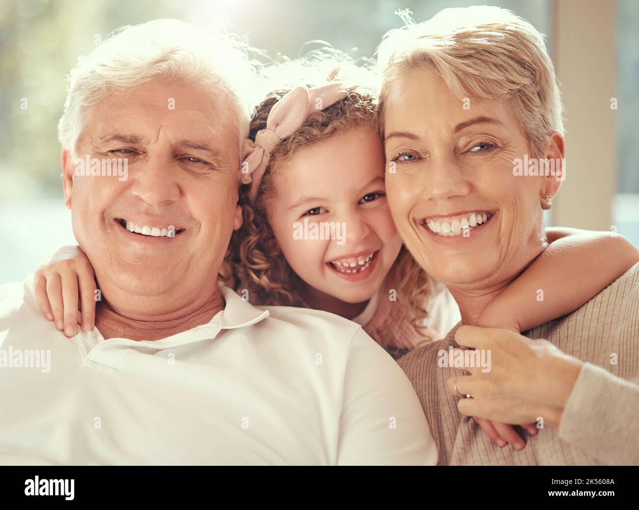 Happy family, children and grandparents hug and bond in living room ...