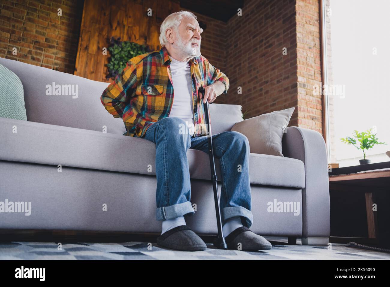 Photo of unhappy tired man pensioner wear checkered shirt trying ...
