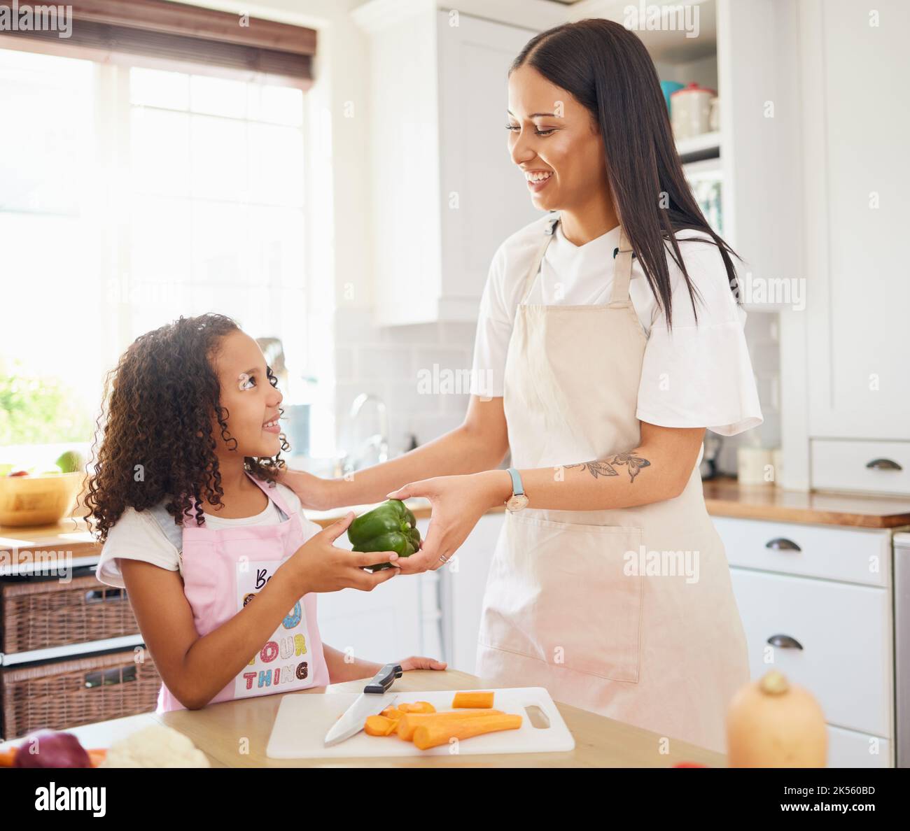 Food, learning and cooking by mother and daughter in a kitchen ...