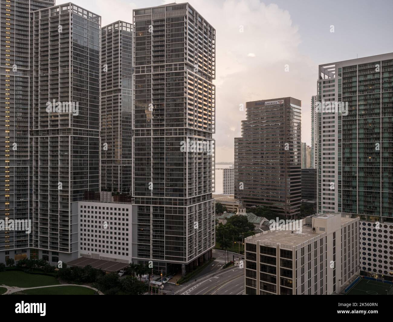 The Downtown Miami at dawn with highrises and water in the background ...