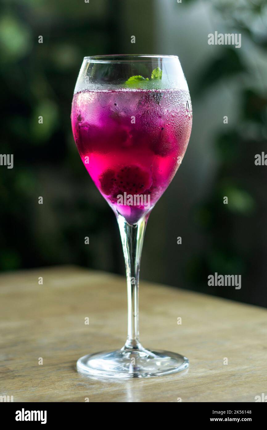 raspberry and red dragon fruit prosecco wine spritzer cocktail Stock ...