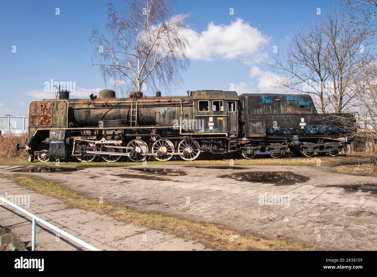 An old and dilapidated historic PKP steam locomotive standing on a ...