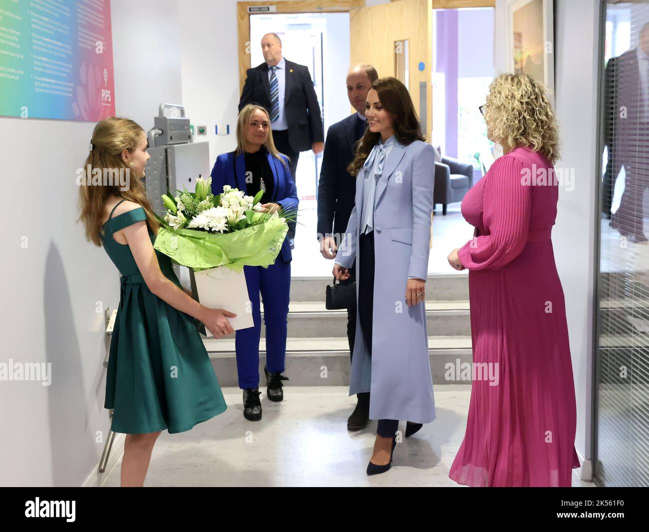 The Prince and Princess of Wales are presented with flowers by 12-year ...