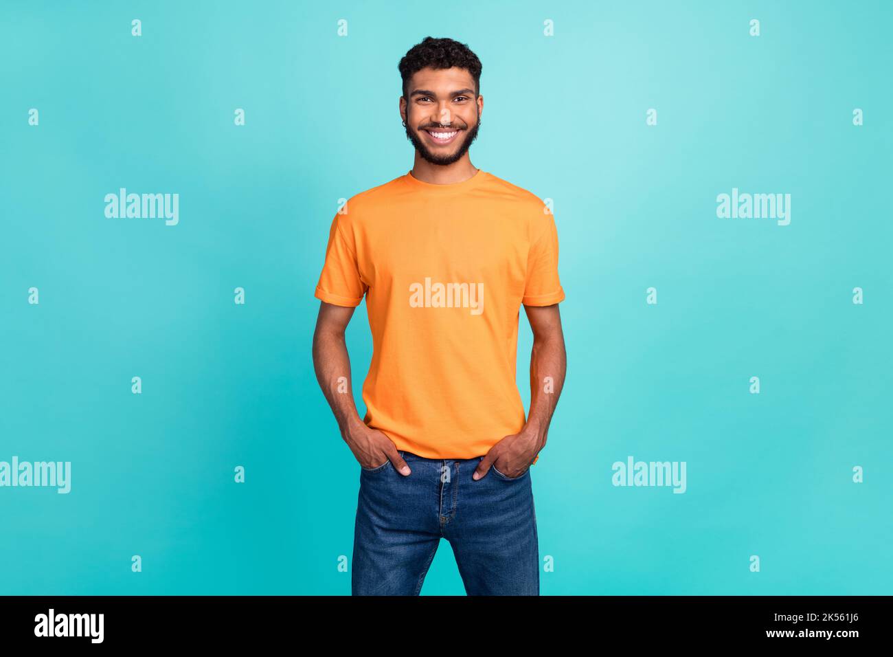 Photo of cute charming man dressed orange t-shirt smiling arms hands ...