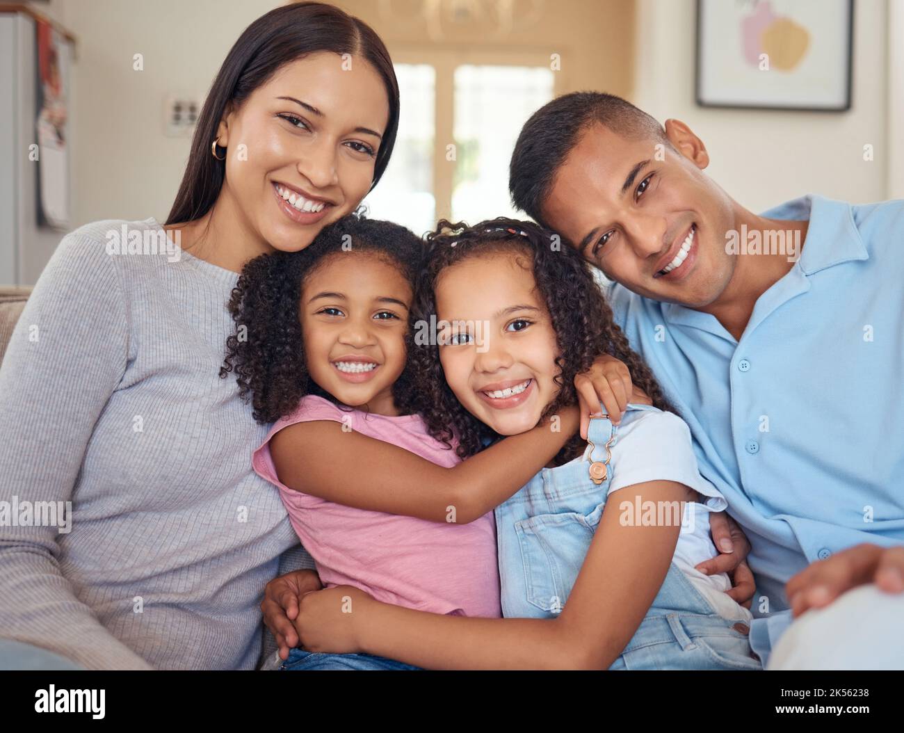 Portrait, happy family and living room sofa hug, smile and bonding for ...