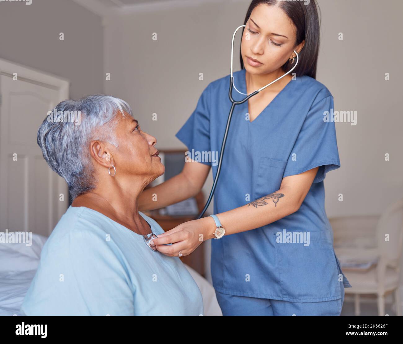 Doctor, stethoscope and senior woman with caregiver checking health ...