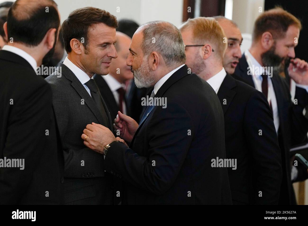 French President Emmanuel Macron (second left) speaks with Prime ...