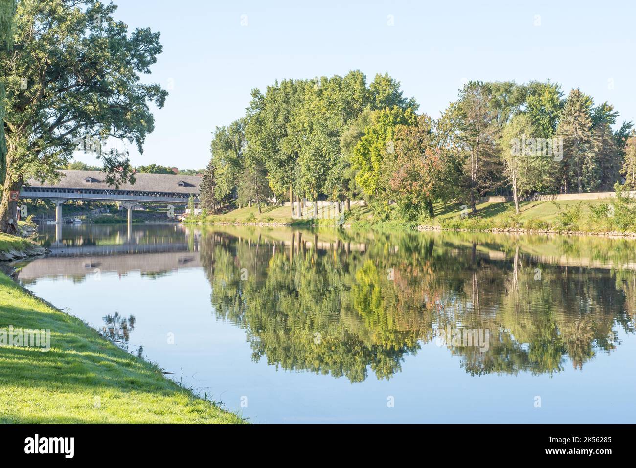 Cass River flows under the Holz Brücke (wooden bridge) in Heritage Park ...
