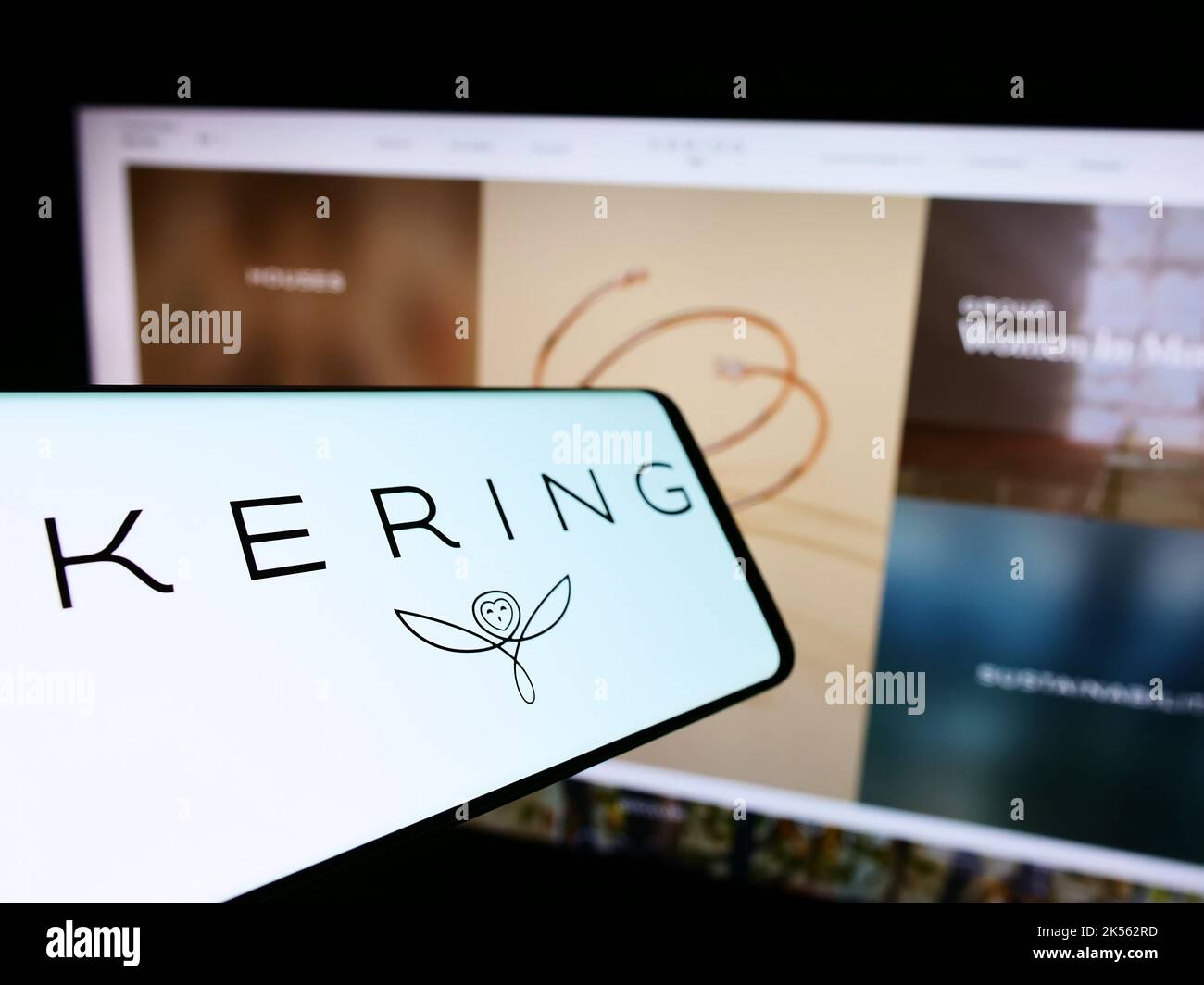 Cellphone with logo of French luxury goods company Kering S.A. on ...