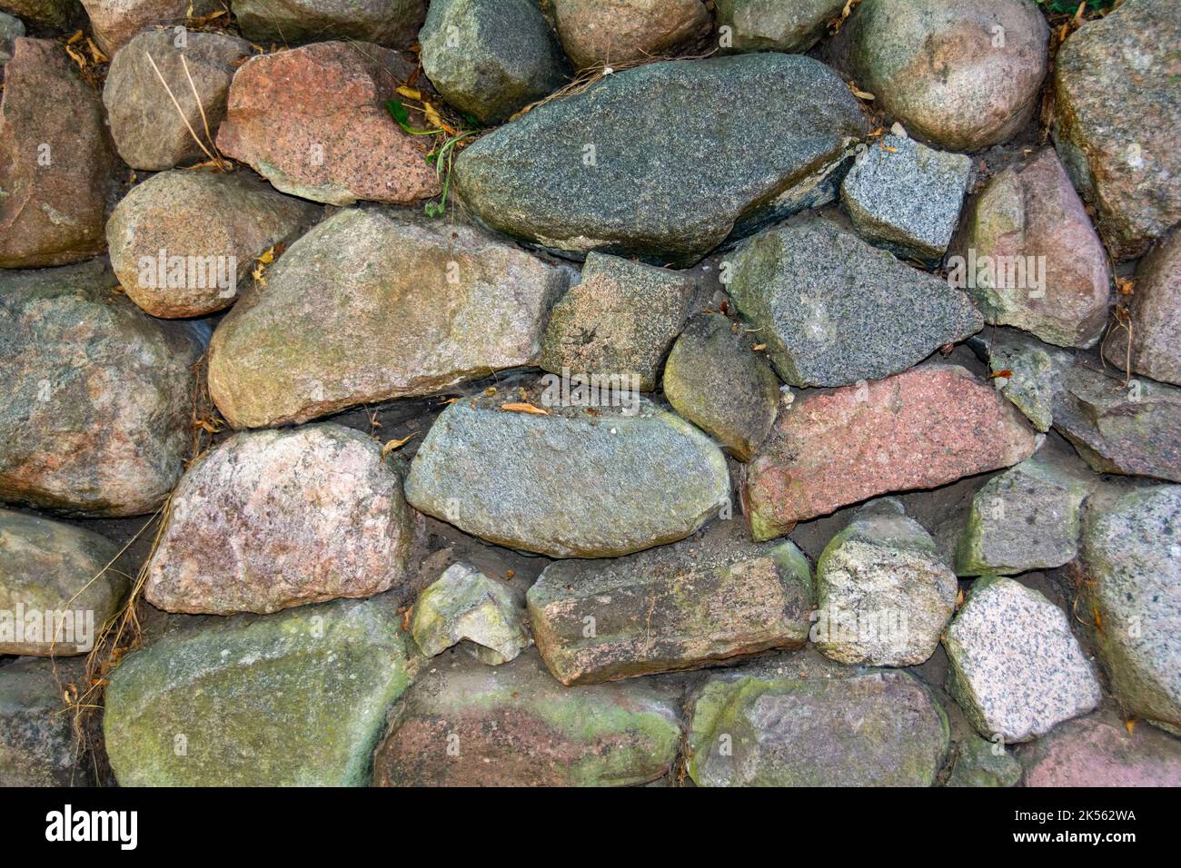 Old stone wall made of stones of different sizes Stock Photo - Alamy