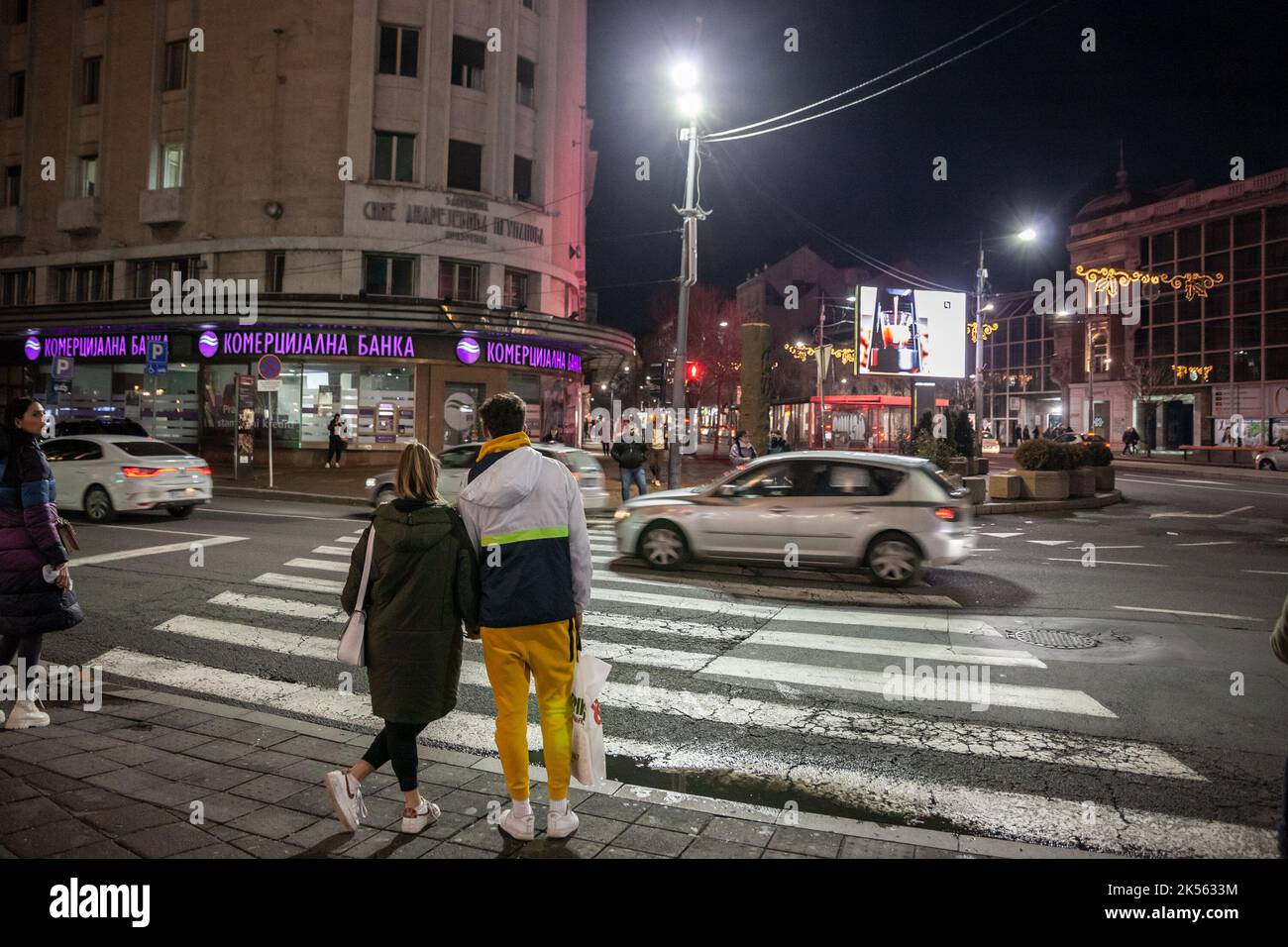 Picture of people waiting for green light to cross a crossroad in the ...