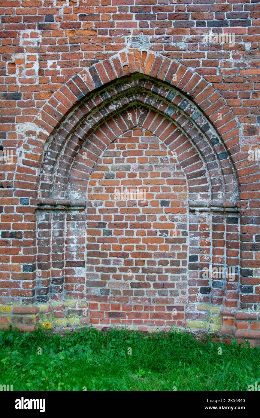 Old stone wall with closed brick arch on a historic building Stock ...