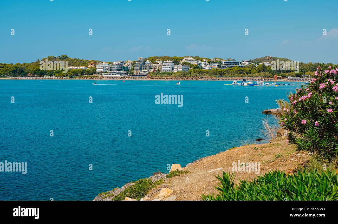 a view over the Vouliagmeni bay in Vouliagmeni, Greece, with the ...