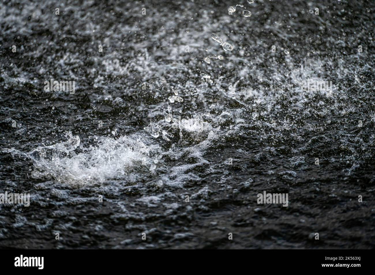 Rain drops on puddle pond hi-res stock photography and images - Alamy