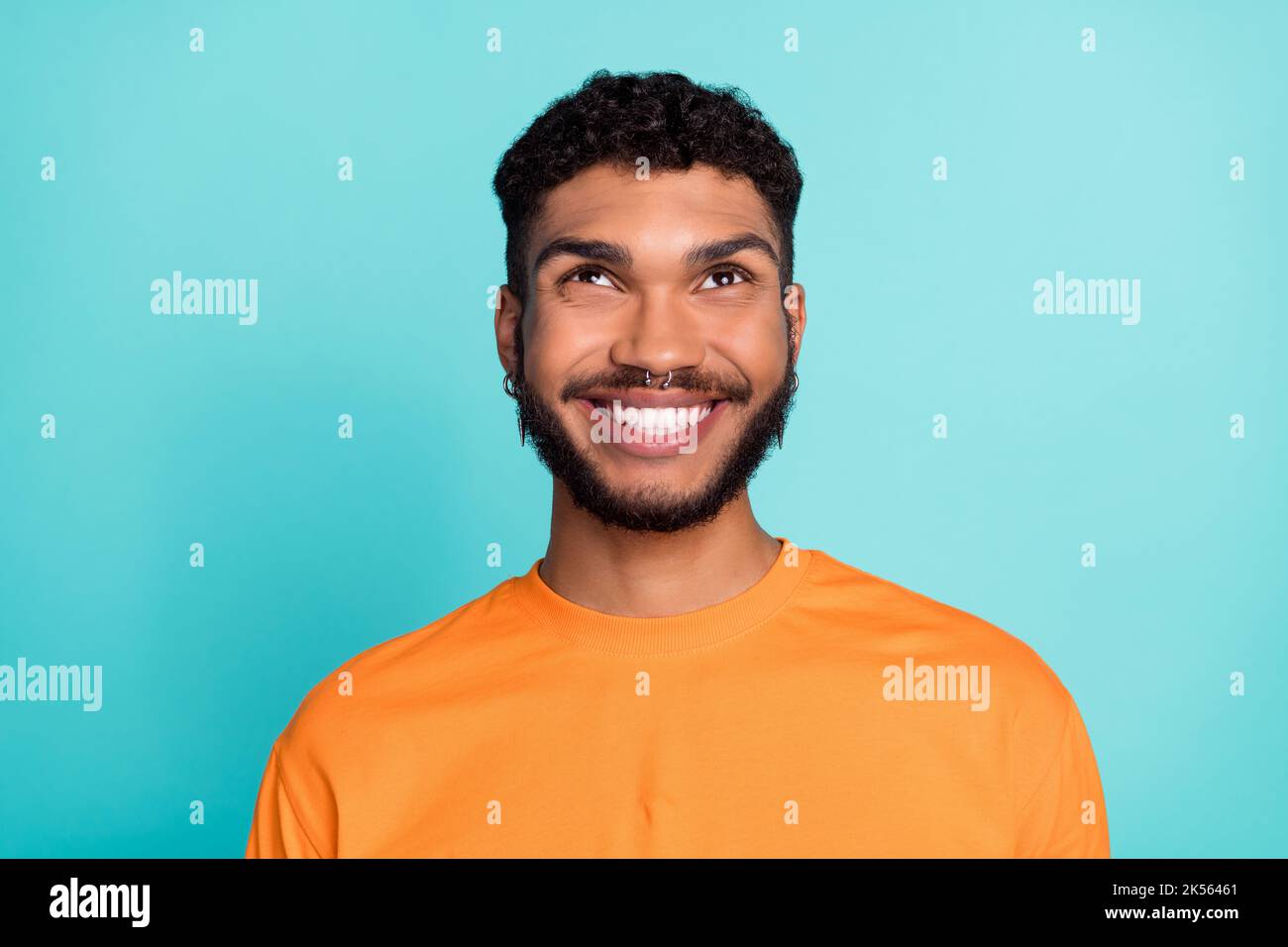 Close up photo of cheerful attractive man interested look empty space ...