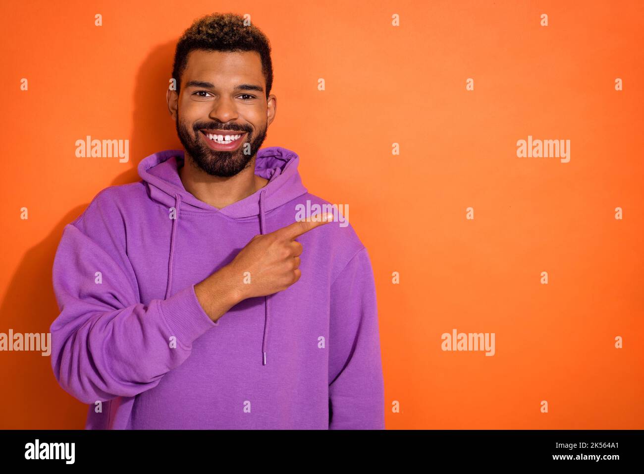 Portrait of cheerful nice person indicate finger empty space promotion ...