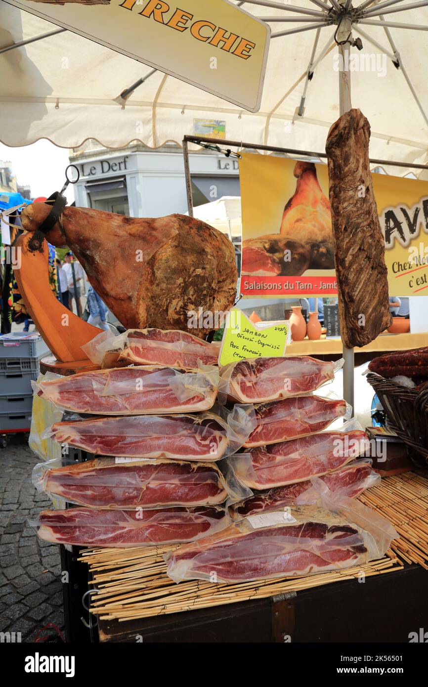 Ham displayed on stall in local market in Places des Lices, Vannes ...