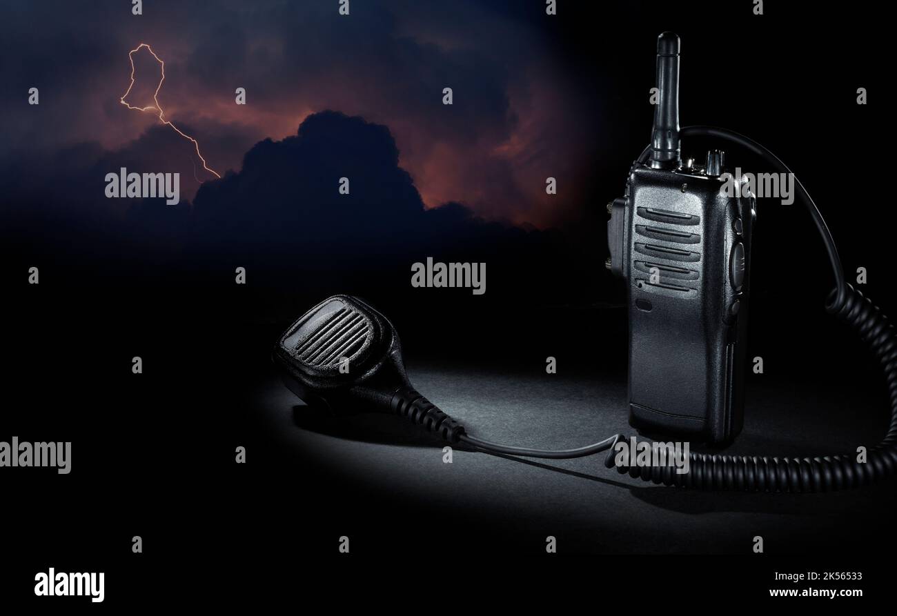 Strong electric storm behind a two way radio with mike Stock Photo - Alamy