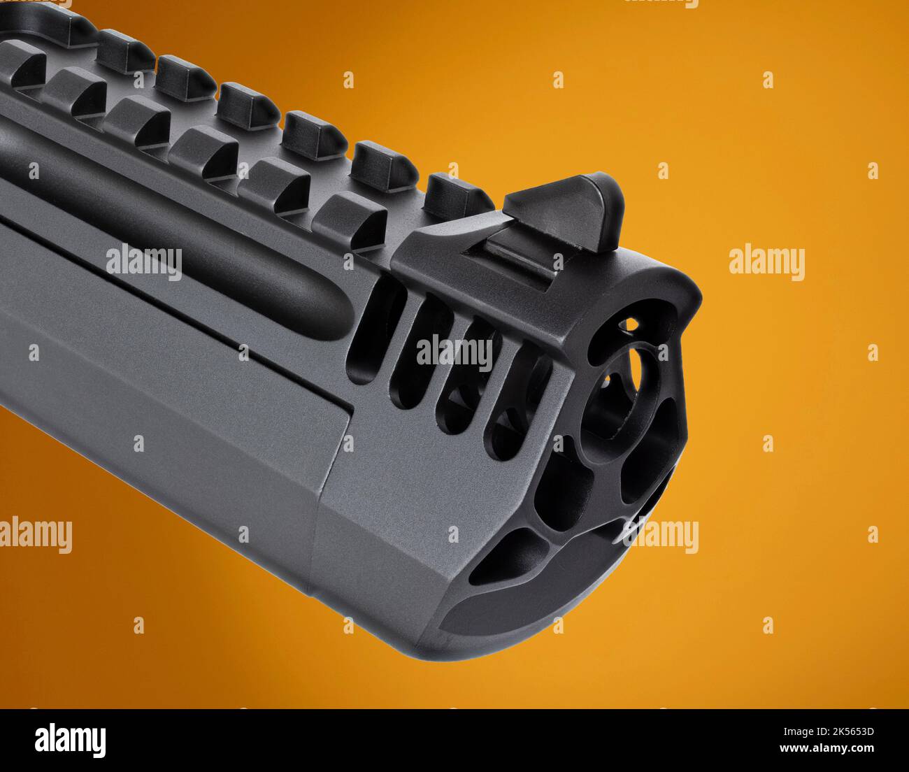 Front sight and rail on a semi automatic handgun on orange Stock Photo ...