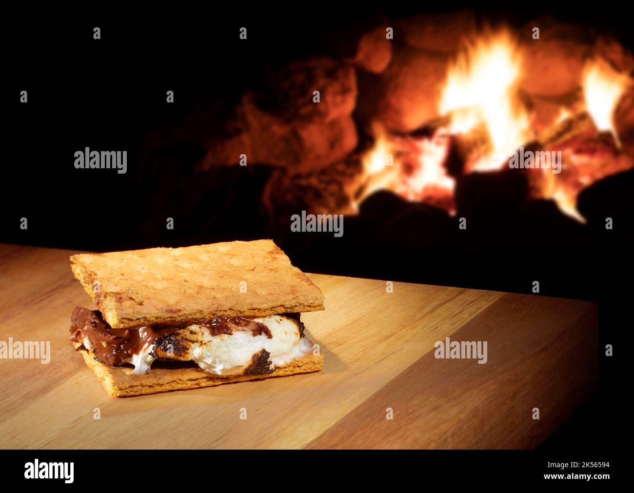 Special camping treat of a smore waiting on the table Stock Photo - Alamy