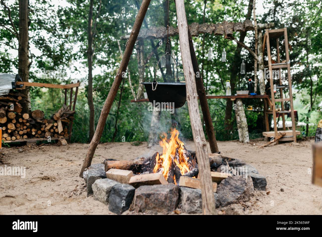 cooking food over a fire in a pot Stock Photo - Alamy